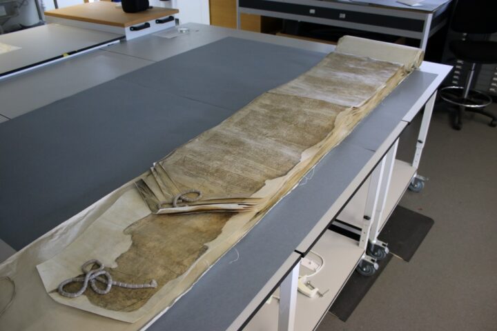 Handling parchment bundles - The National Archives