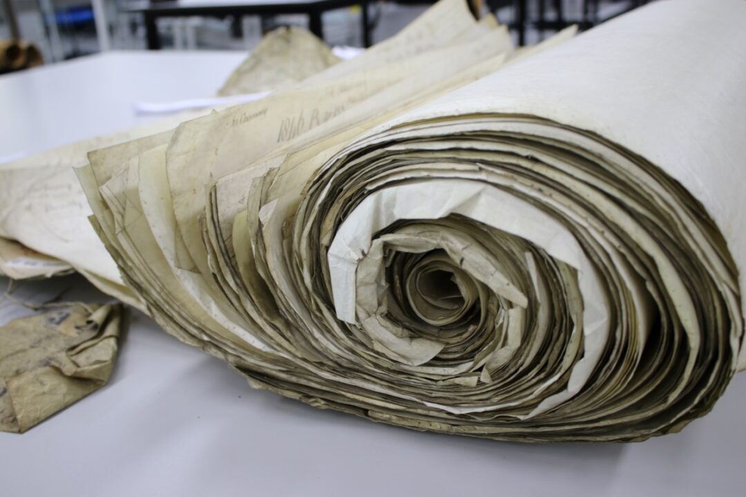 Handling rolled maps and paper bundles - The National Archives